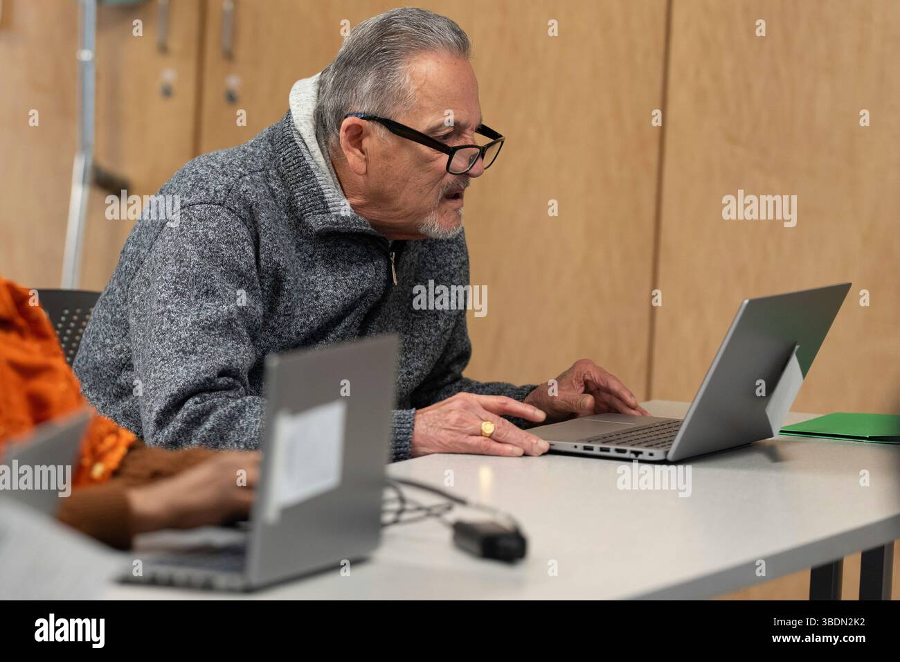 John Castro looks at his computer during a keyboard basics class ...