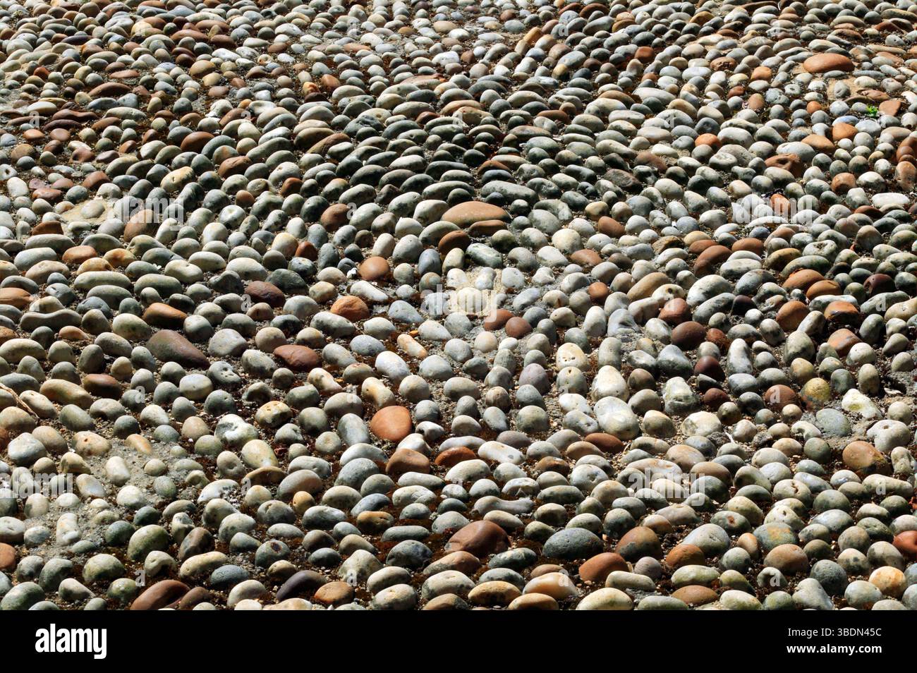 Old fashioned patterned cobbled stone pathway background with stone ...