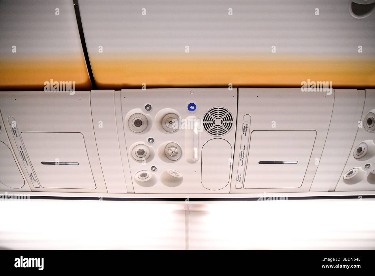Passenger service panel in the aircraft cabin Stock Photo - Alamy