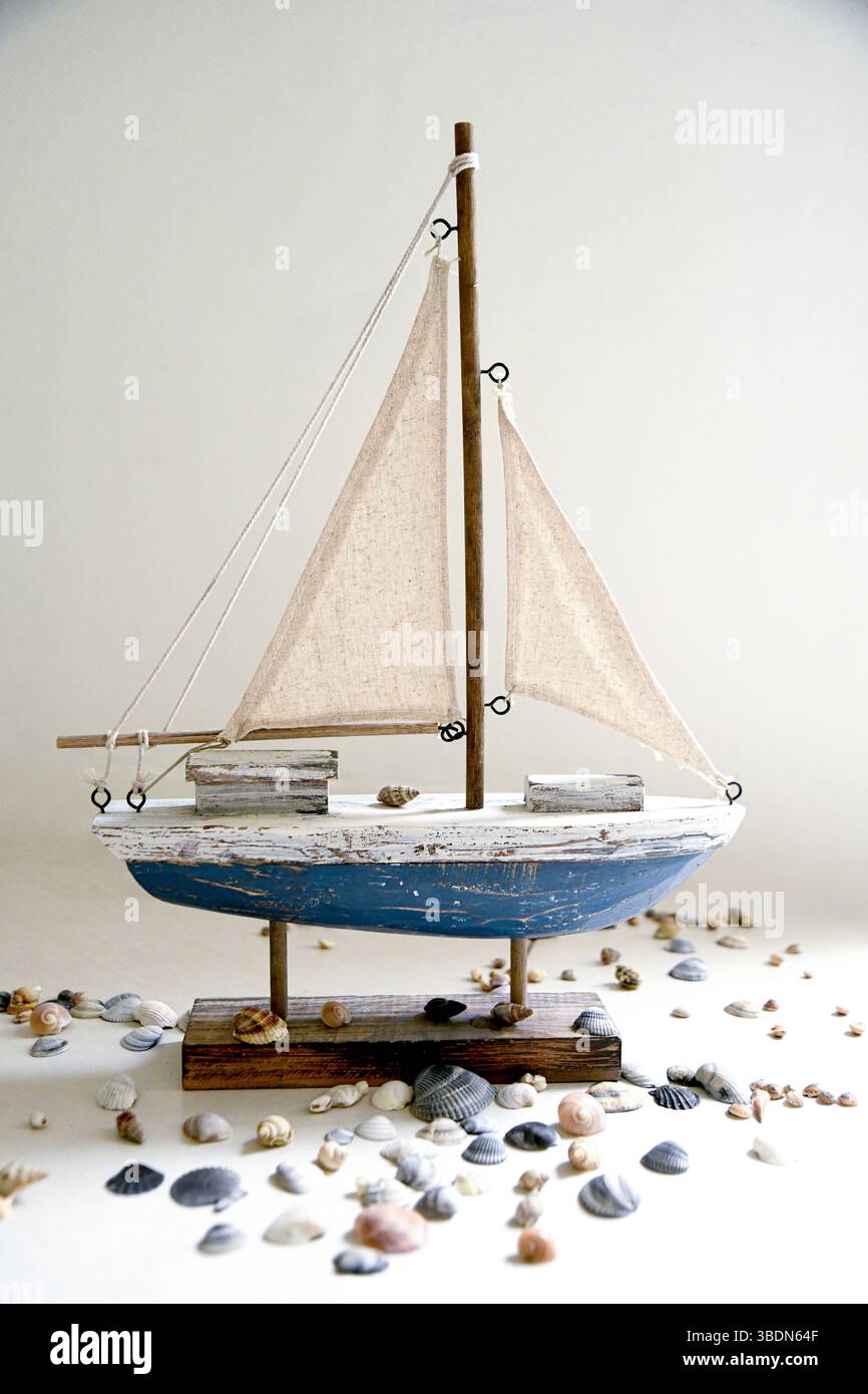 Decorative wooden boat with shells Stock Photo - Alamy