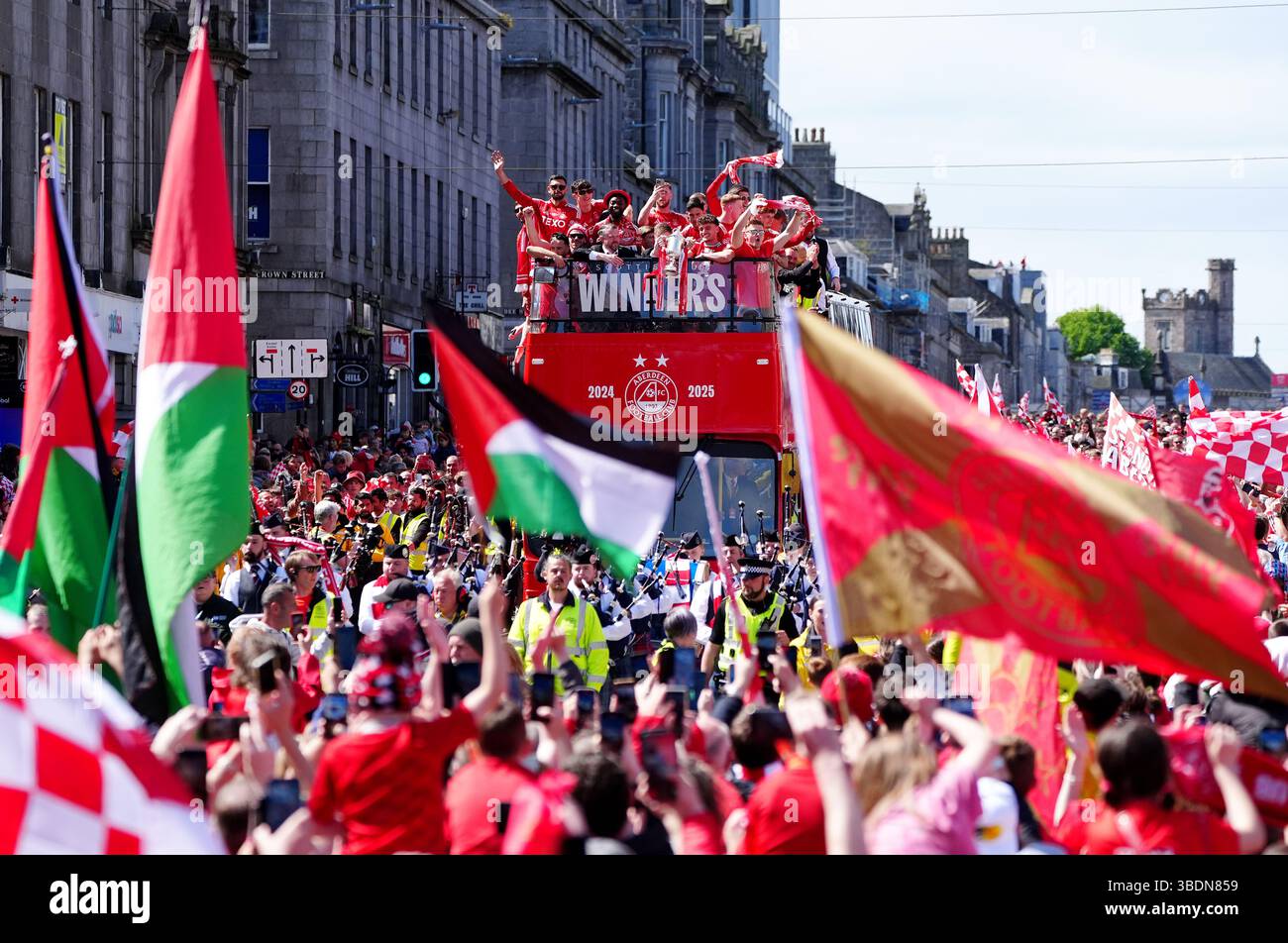 The team bus carrying Aberdeen players on Union Street is greeted by fans during the Scottish ...
