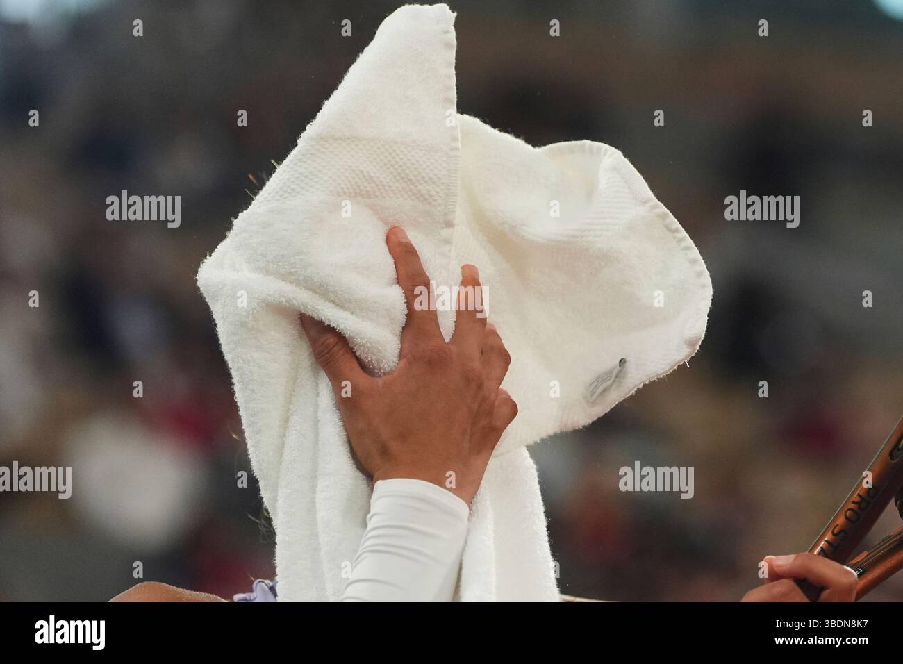 China's Zheng Qinwen wipes her face as she plays Russia's Anastasia ...