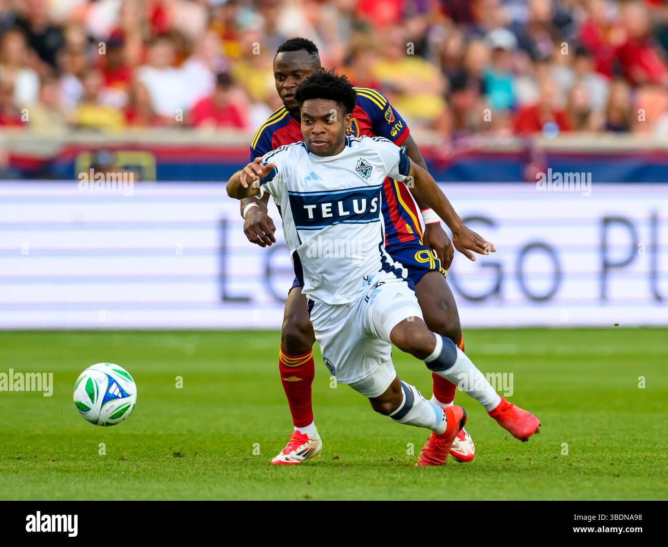Vancouver Whitecaps midfielder Ralph Priso, front, and Real Salt Lake striker William Agada ...