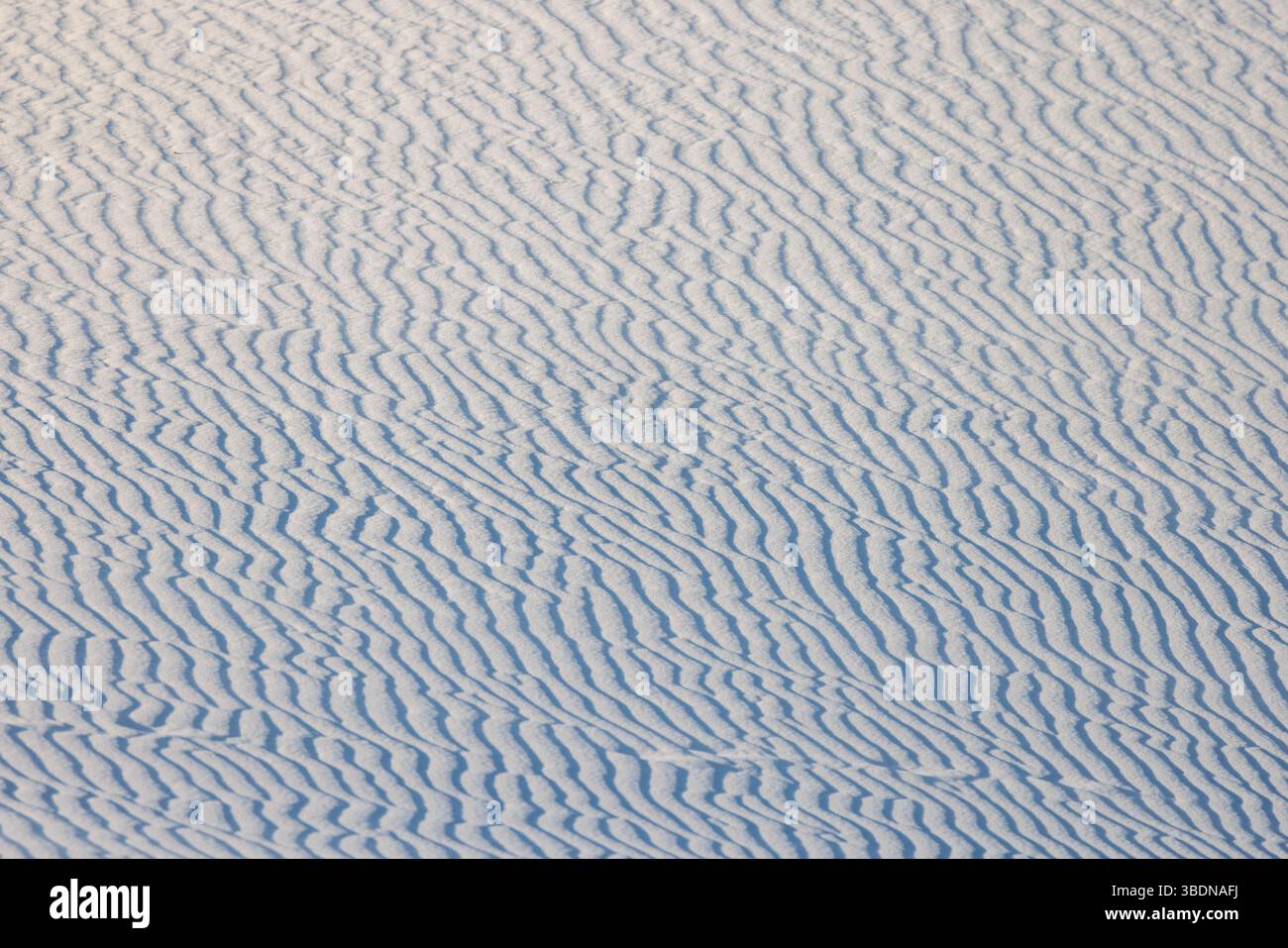 Wind creates wave patterns in the sand dunes at White Sands National ...