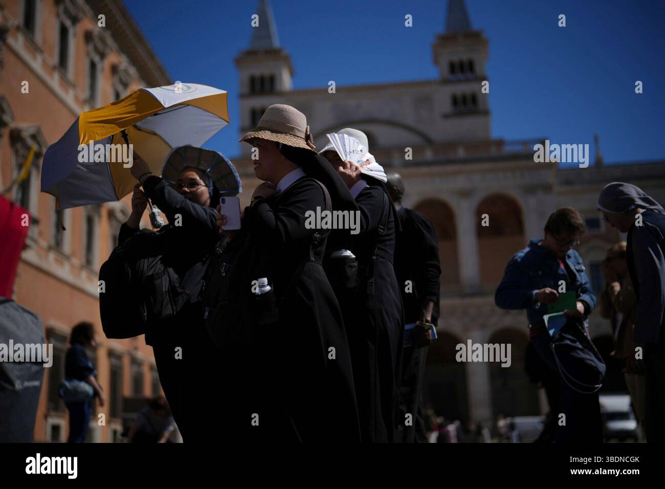 Nuns wait outside Arch Basilica of St. John Lateran where Pope Leo XIV ...