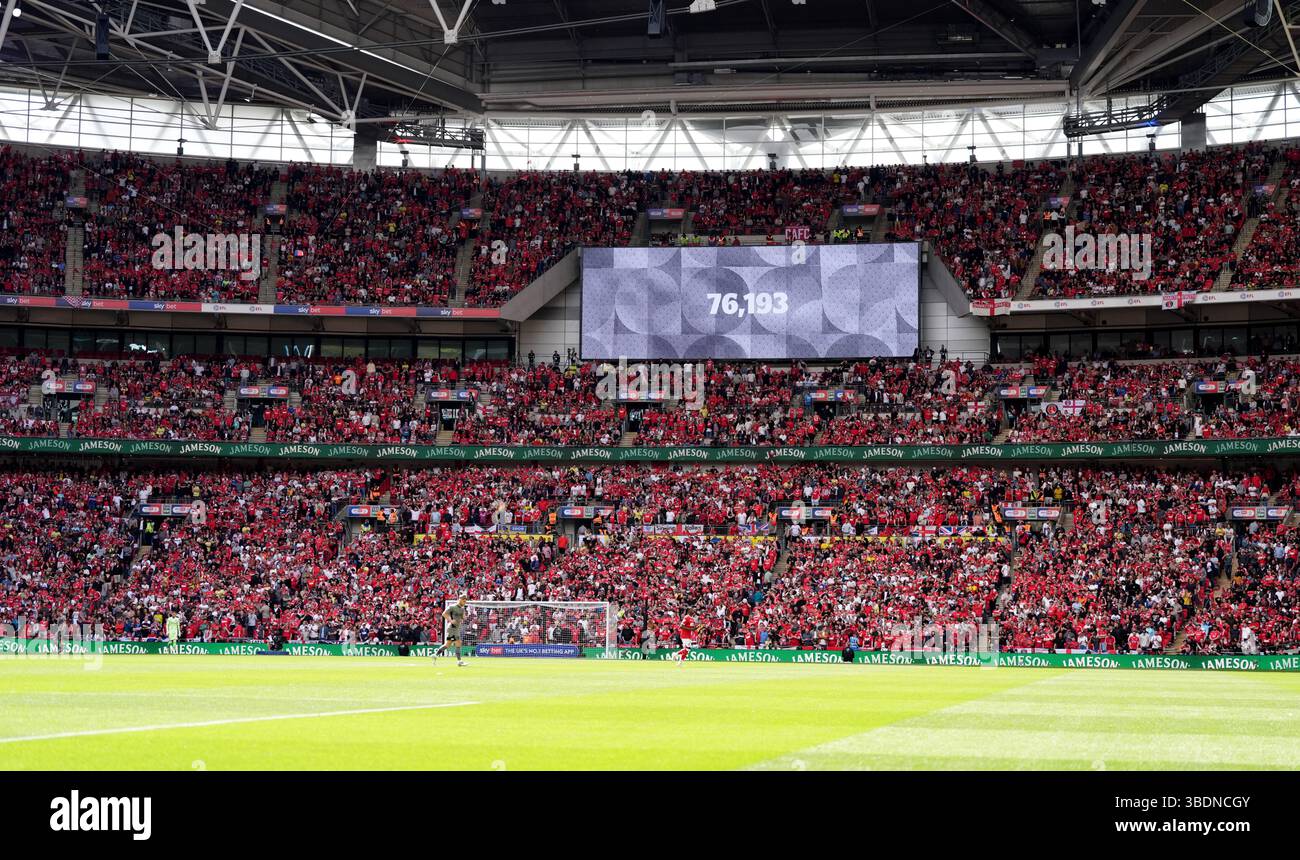 The stadiums big screen displays the match attendance of 76,193 during ...