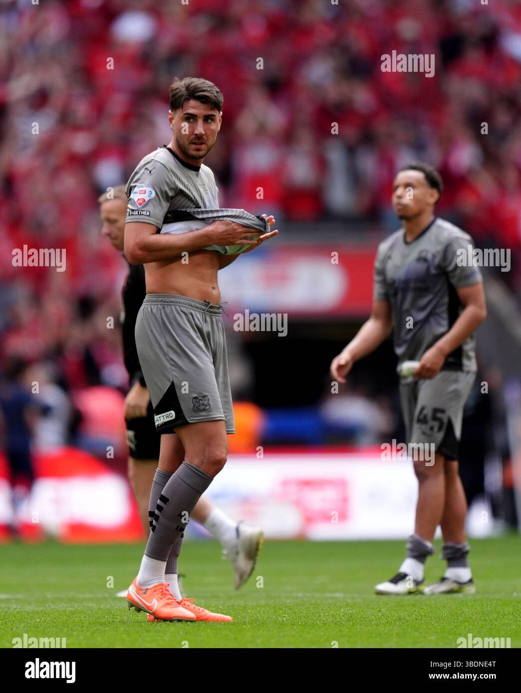Leyton Orient's Dan Happe shows his dejection at the final whistle ...