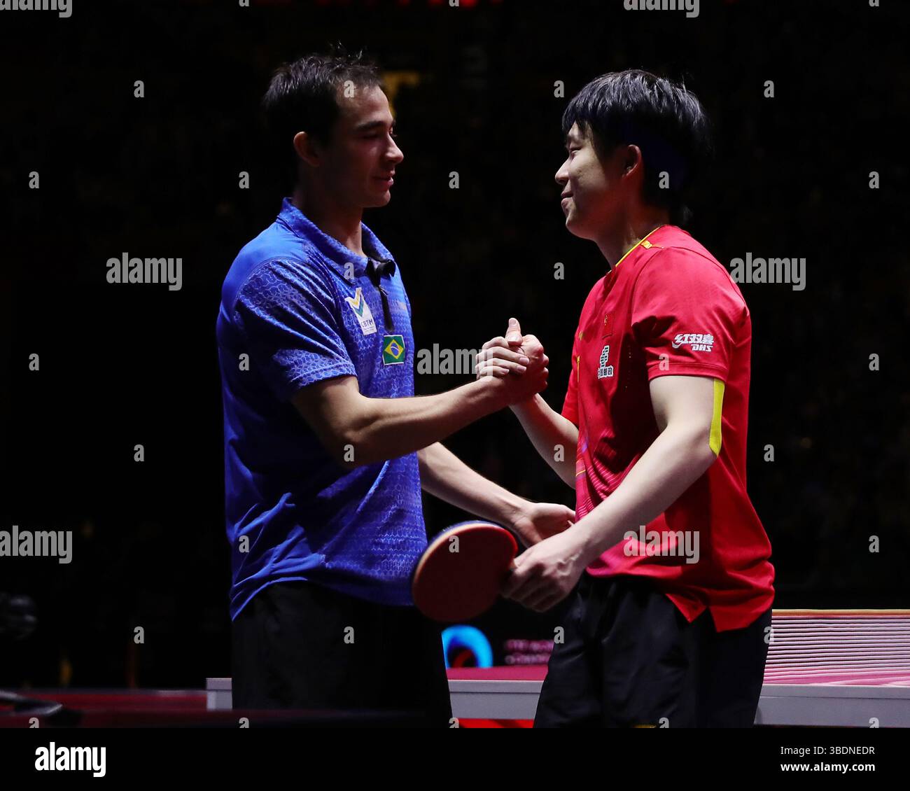 Doha, Qatar. 25th May, 2025. Wang Chuqin (R) greets Hugo Calderano ...