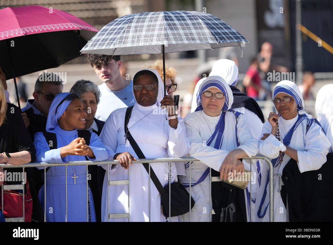 Nuns wait outside Arch Basilica of St. John Lateran where Pope Leo XIV ...
