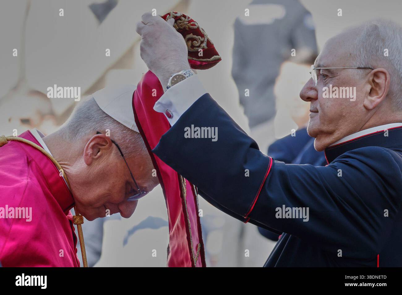 Pope Leo XIV is helped by Monsignor Leonardo Sapienza to wear a stole ...