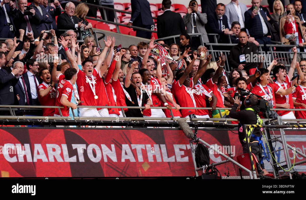 Charlton Athletic's Greg Docherty lifts the trophy after the Sky Bet ...