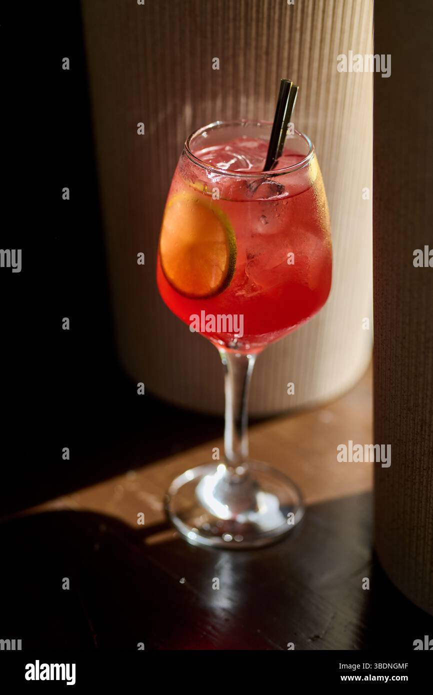 Aperol spritz cocktail with lemon and ice in a glass Stock Photo - Alamy