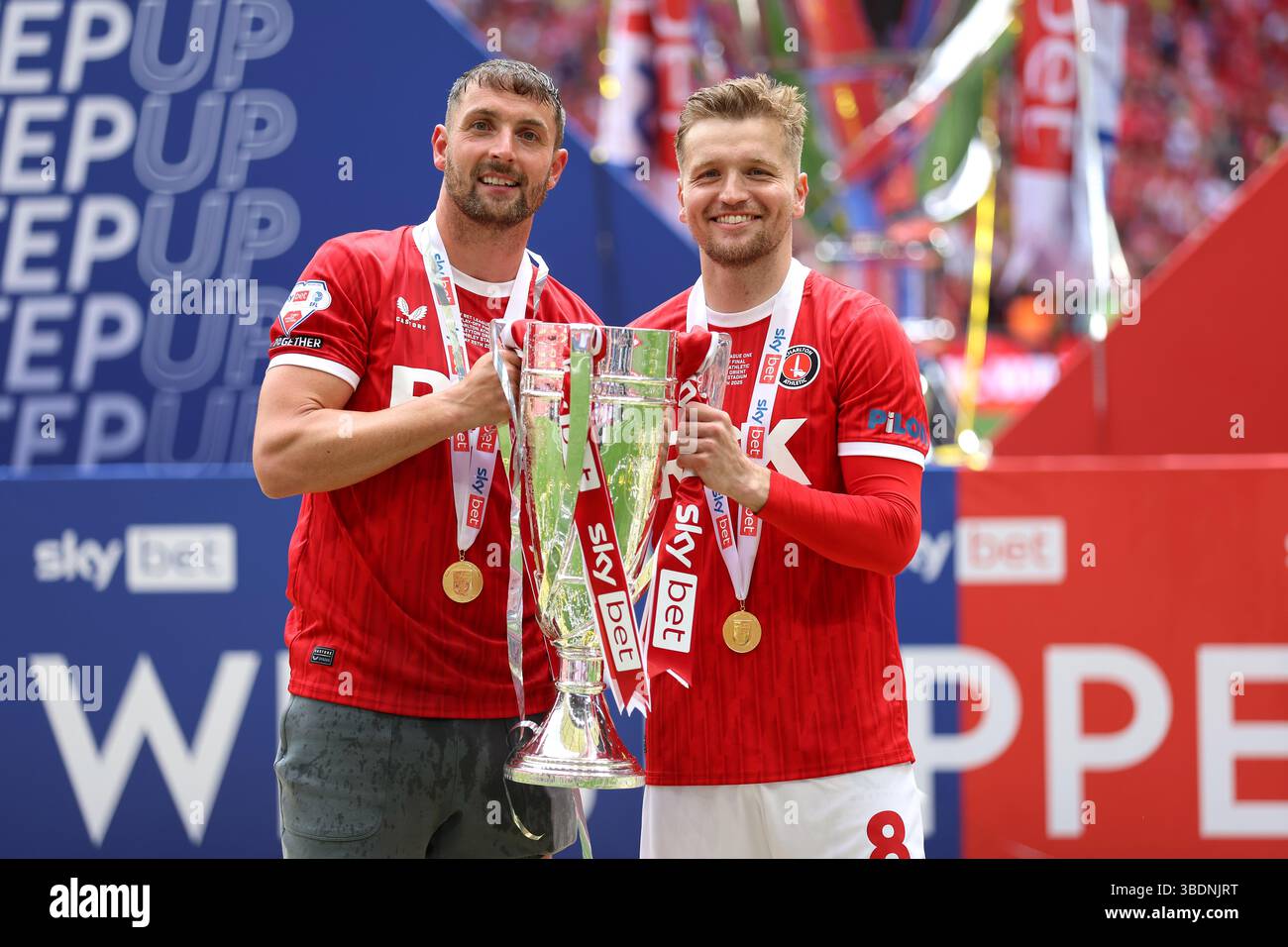 Charlton Athletic's Luke Berry (right) with the trophy after winning ...