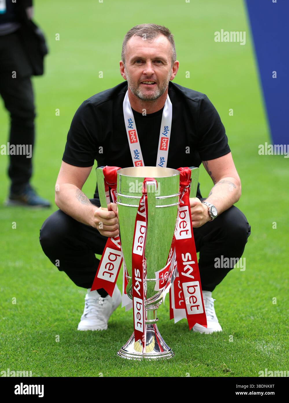 Charlton Athletic manager Nathan Jones with the trophy after winning ...