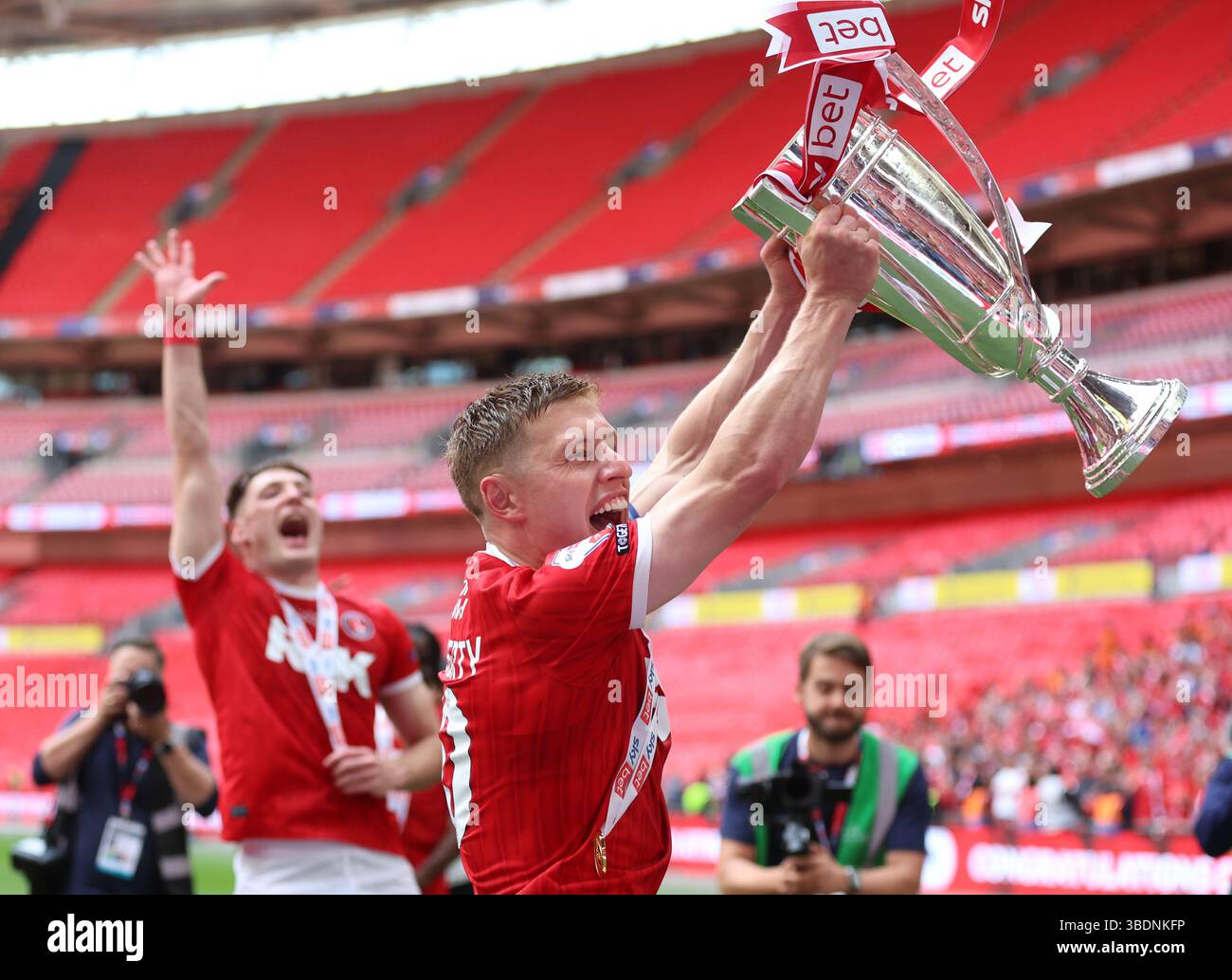 Charlton Athletic's Greg Docherty with the trophy after winning the Sky ...