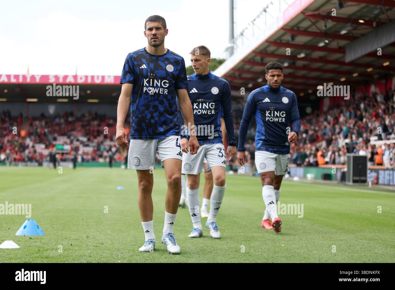 Leicester City's Conor Coady (left) and Luke Thomas (centre) warming-up ...