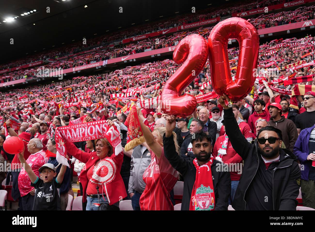 Liverpool fans cheer for their team before the start of the English ...