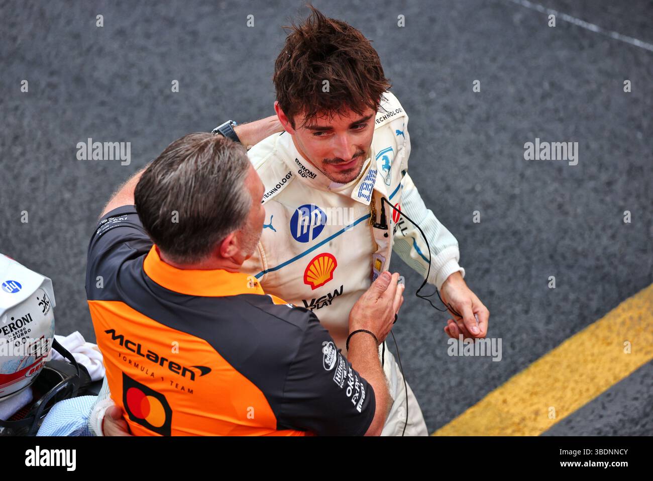 Monaco, Monte Carlo. 25th May, 2025. Charles Leclerc (MON) Ferrari with Zak Brown (USA) McLaren ...