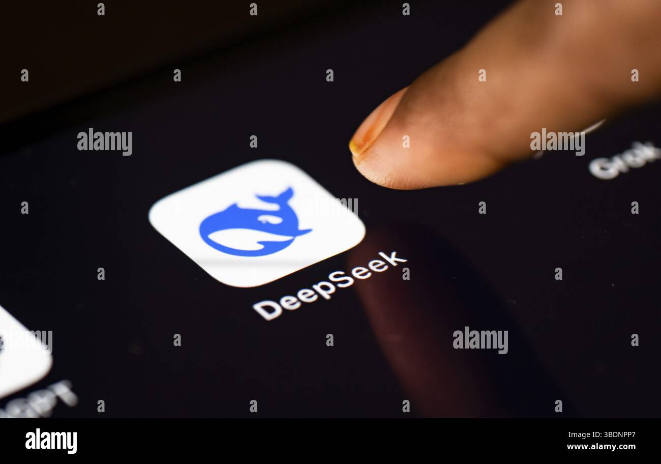 In this photo Illustration a person taps Deepseek App icon on a tablet ...