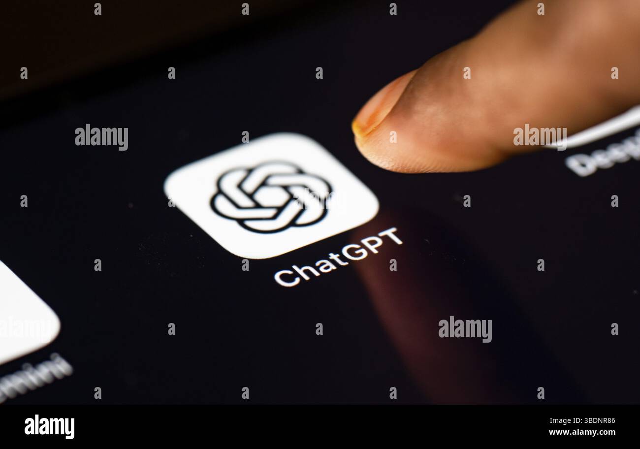 In this photo Illustration a person taps ChatGPT app icon on a tablet ...