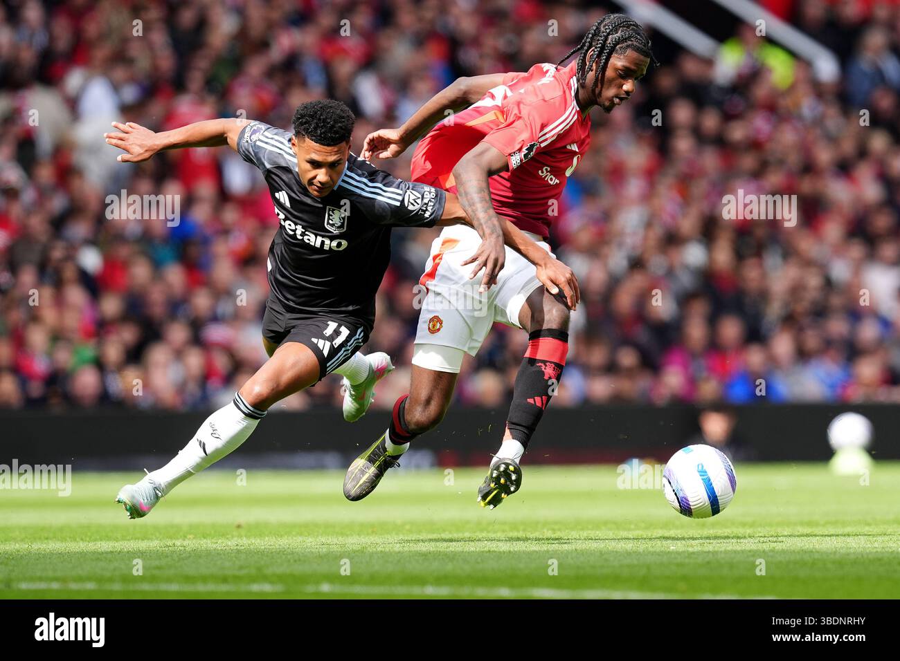 Aston Villa's Ollie Watkins (left) and Manchester United's Ayden Heaven ...