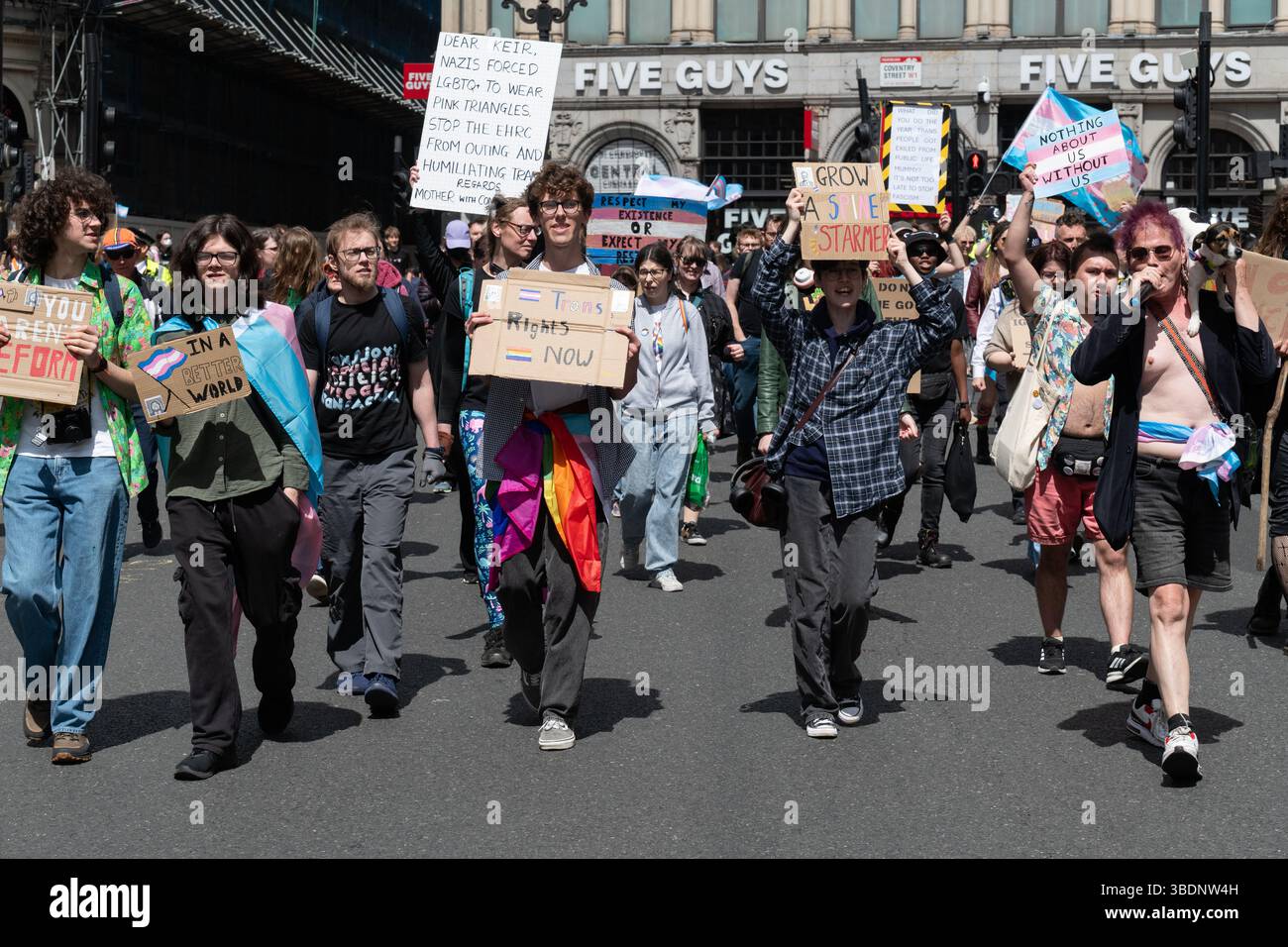 London, UK. 25 May, 2025. Transgender people and allies march from ...