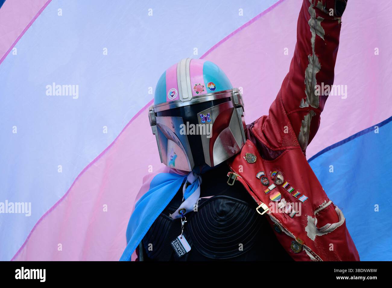 London, UK. 25 May, 2025. An activist wears a Boba Fett style helmet painted in the colours of ...