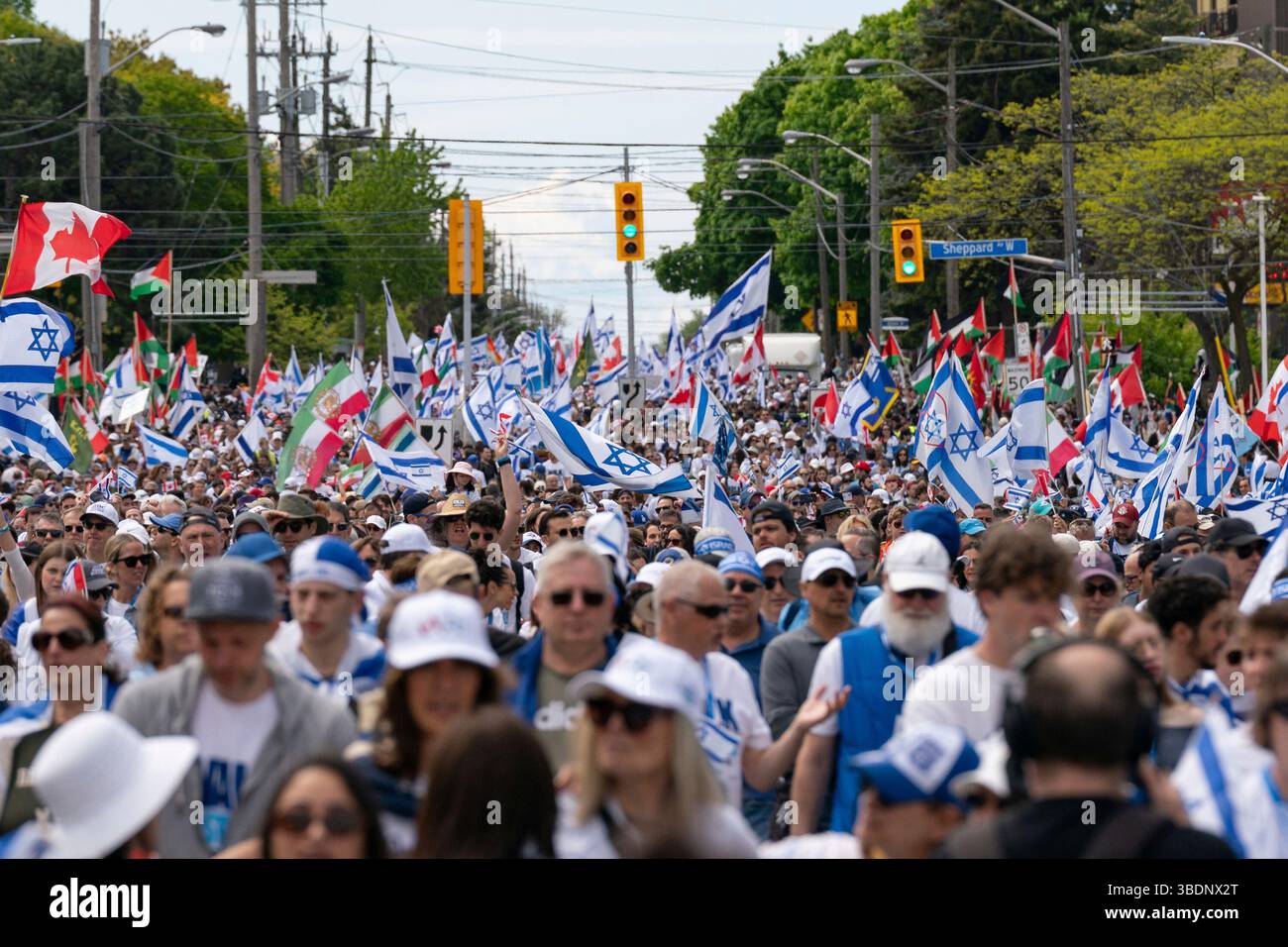 People participate in the United Jewish Appeal's annual Walk With Israel march in Toronto ...