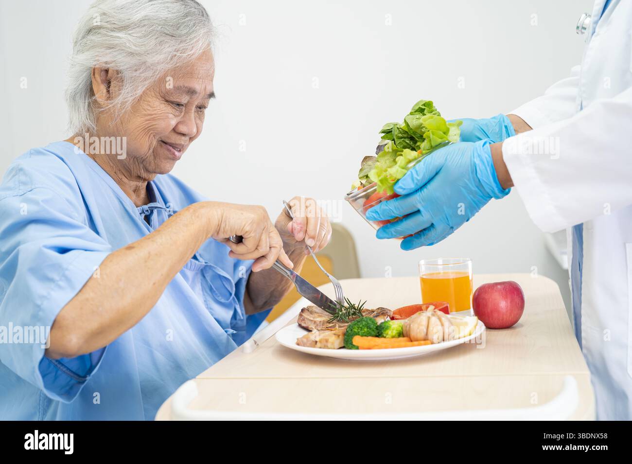 Asian senior or elderly old lady woman patient eating breakfast and ...