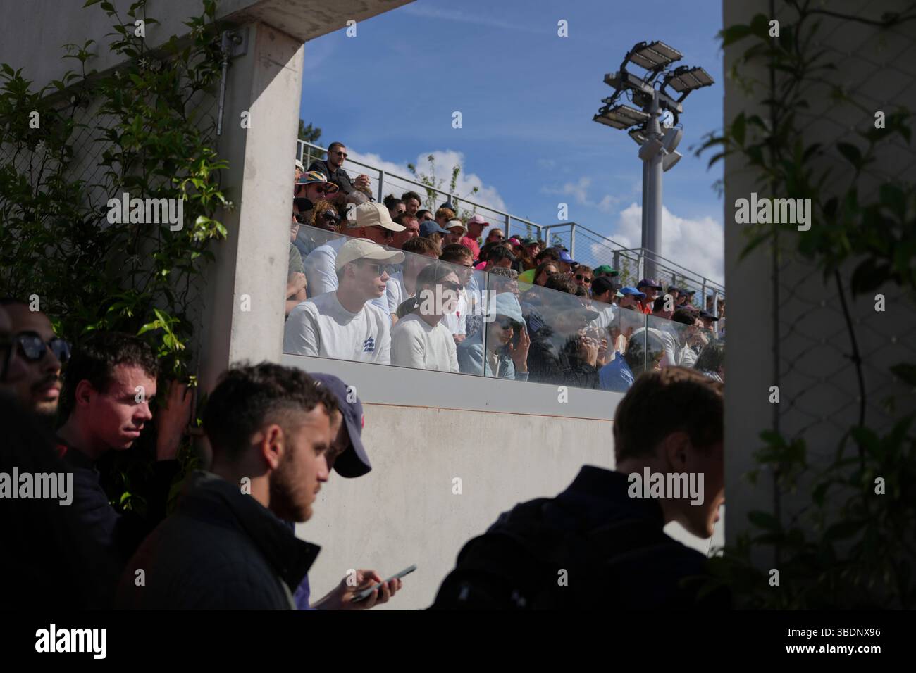 Spectators follow a match of the French Tennis Open, at the Roland ...