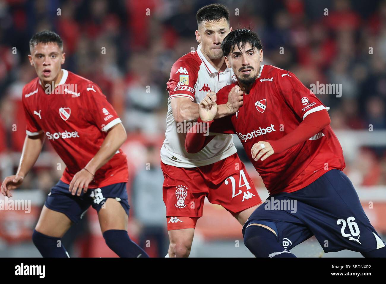Independiente's defender Kevin Lomonaco (R) and Huracan's defender ...