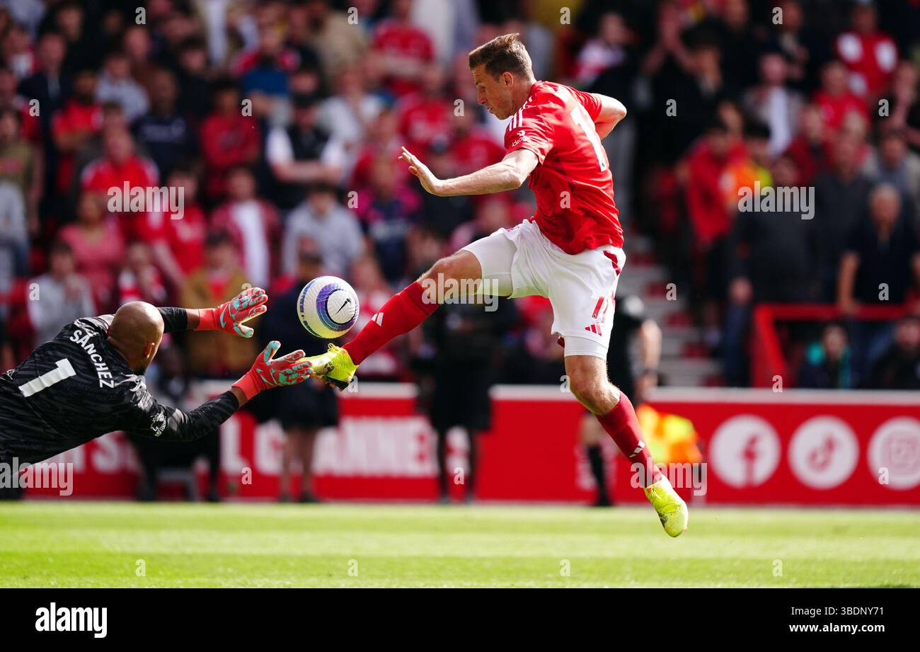 Nottingham Forest's Chris Wood shoots under pressure from Chelsea ...