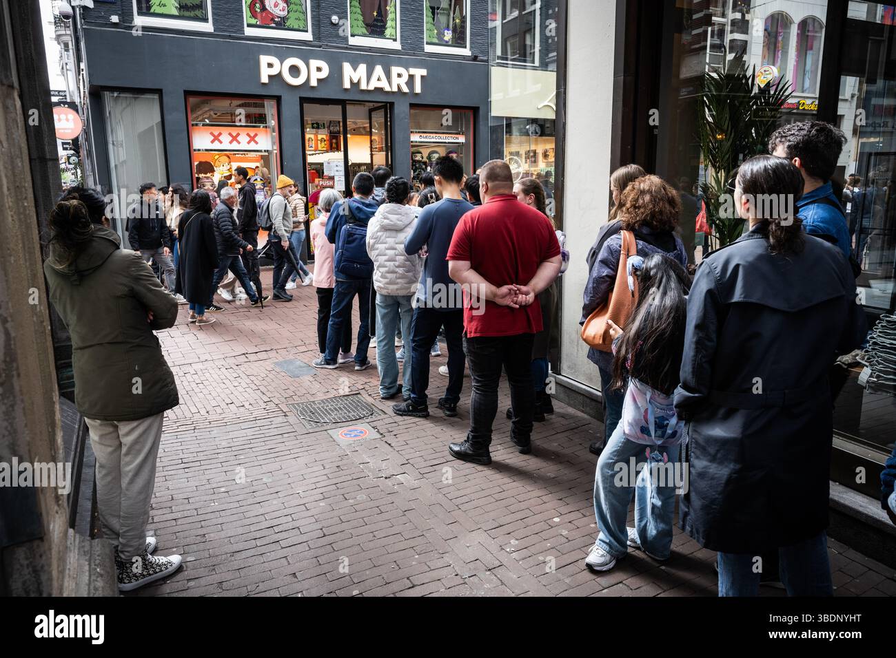 AMSTERDAM - Queues at the Pop Mart store on Kalverstraat. People line ...