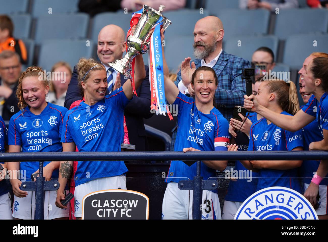 Rangers' Jane Ross (right) with the trophy, celebrates with team mates ...