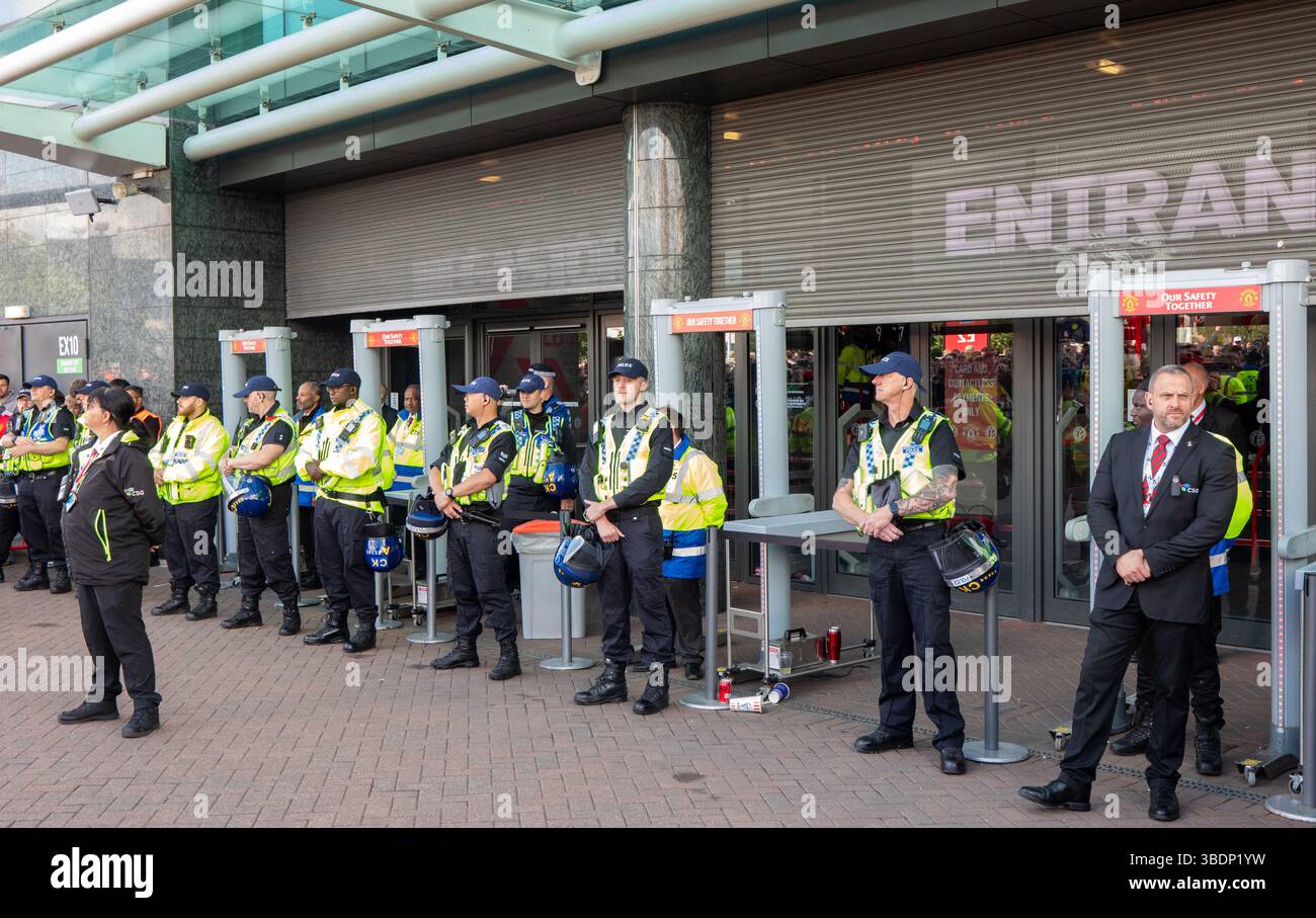 Police and Security staff guard entrance to Manchester United Megastore ...