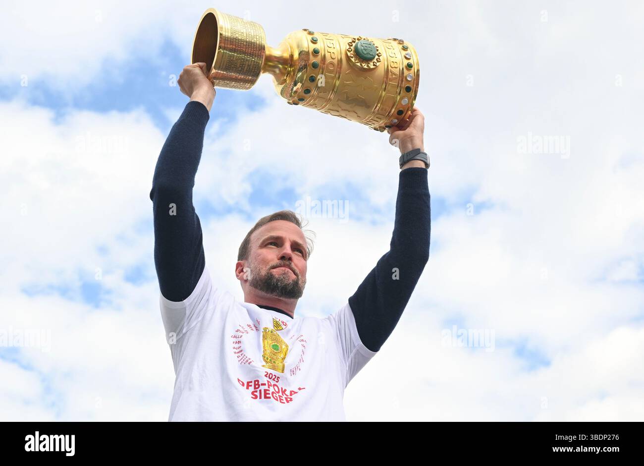 Stuttgart coach Sebastian Hoenes lifts the DFB cup at the reception on ...