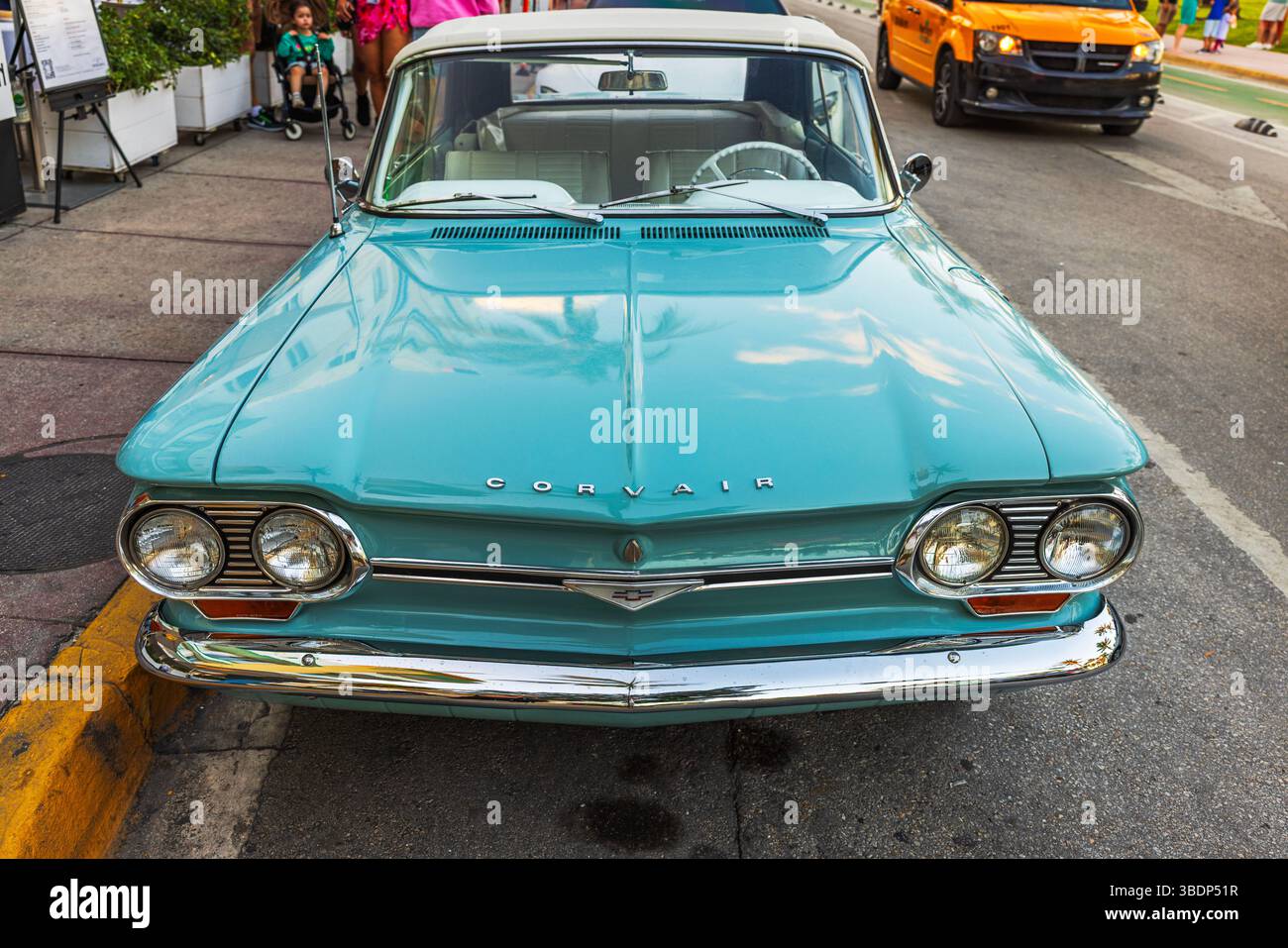 Front view of vintage turquoise Chevrolet Corvair parked on Ocean Drive ...