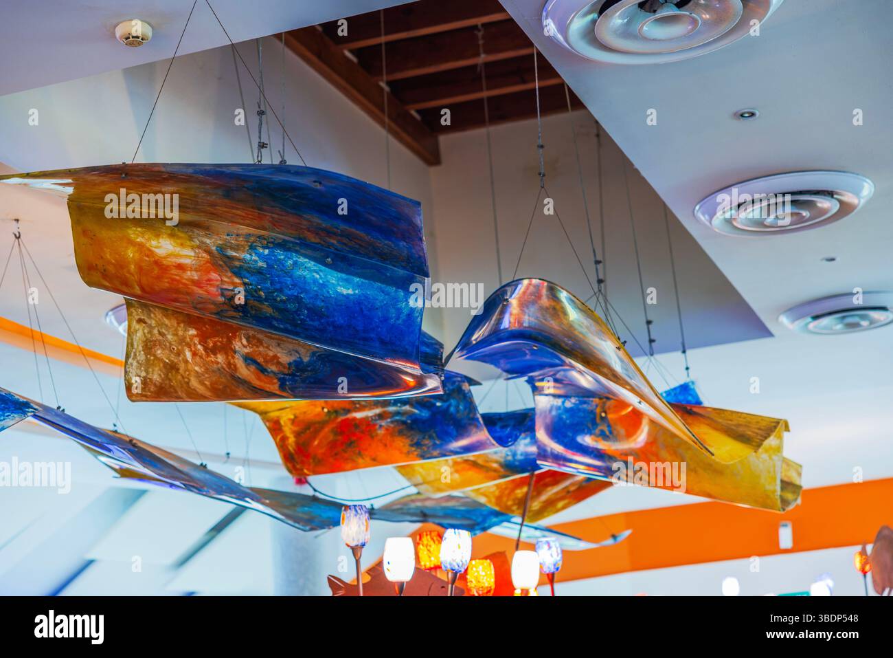 Colorful abstract ceiling sculpture made of large, curved panels in ...