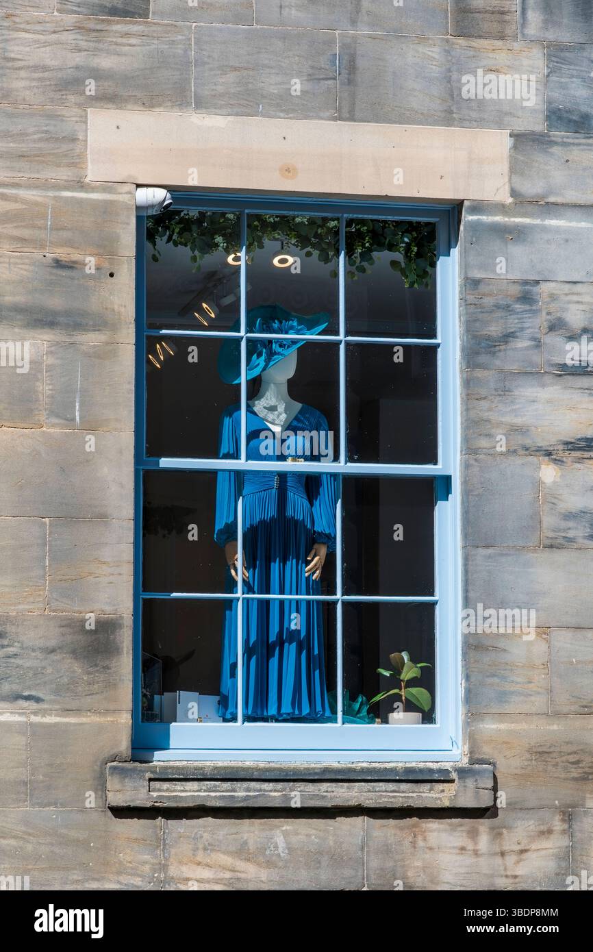 Blue dress and hat on display in a shop window, UK Stock Photo - Alamy