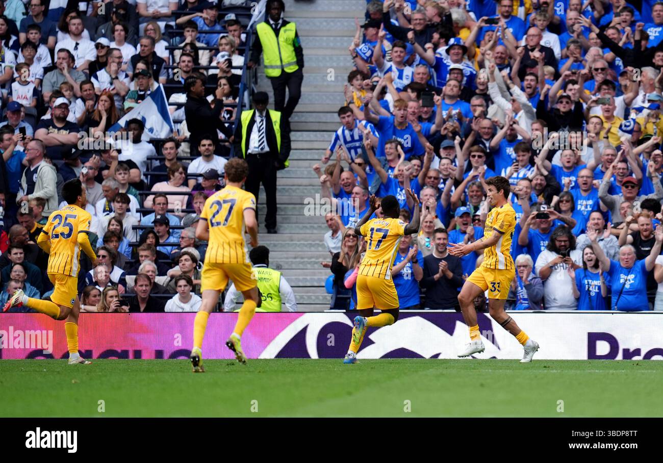 Brighton and Hove Albion's Matt O'Riley (right) celebrates after ...