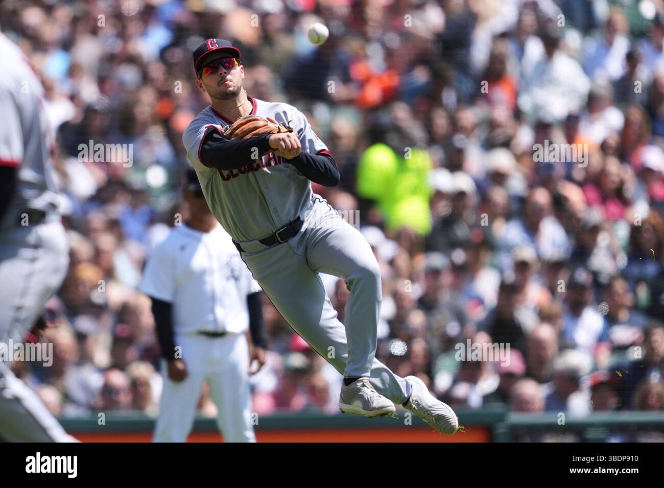 Cleveland Guardians third baseman Will Wilson throws late to first base ...