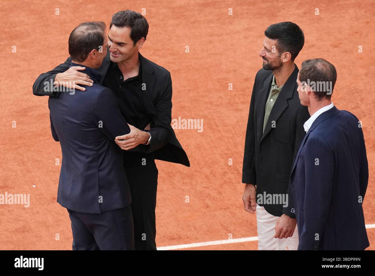 Rafa Nadal, left, hugs Roger Federer, as Novak Djokovic and Andy Murray ...