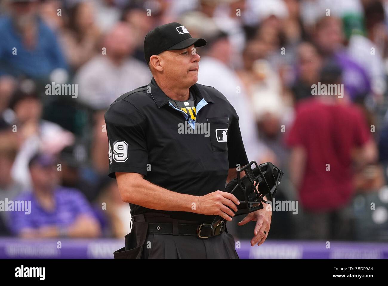 Home plate umpire Andy Fletcher (49) in the sixth inning of a baseball ...