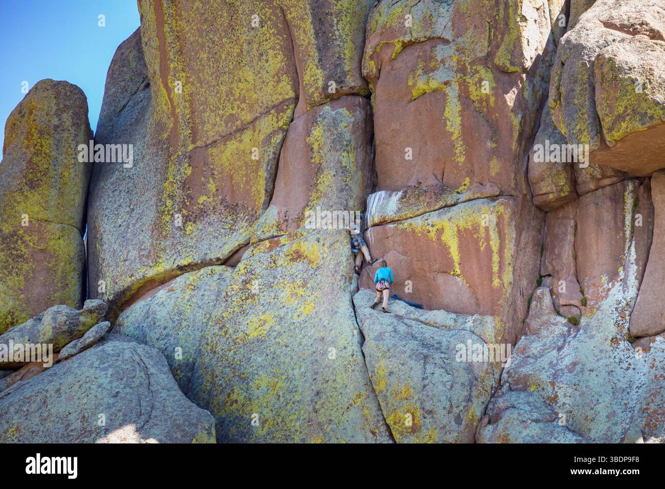 Man and woman rock climbing in the Vedauwoo Recreation Area of Medicine ...