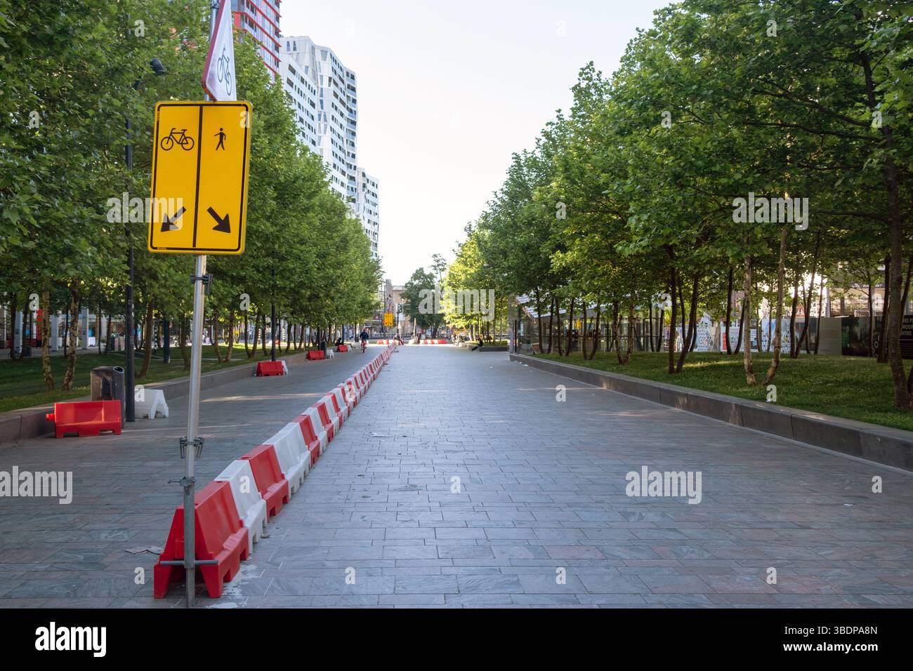 Traffic lanes temporary separation with red and white plastic barriers ...