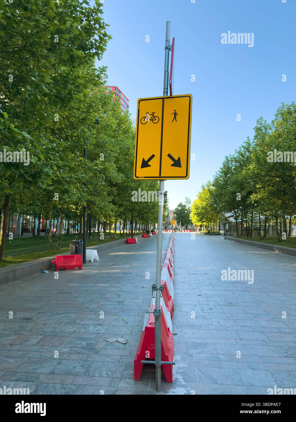 Traffic lanes temporary separation with red and white plastic barriers ...