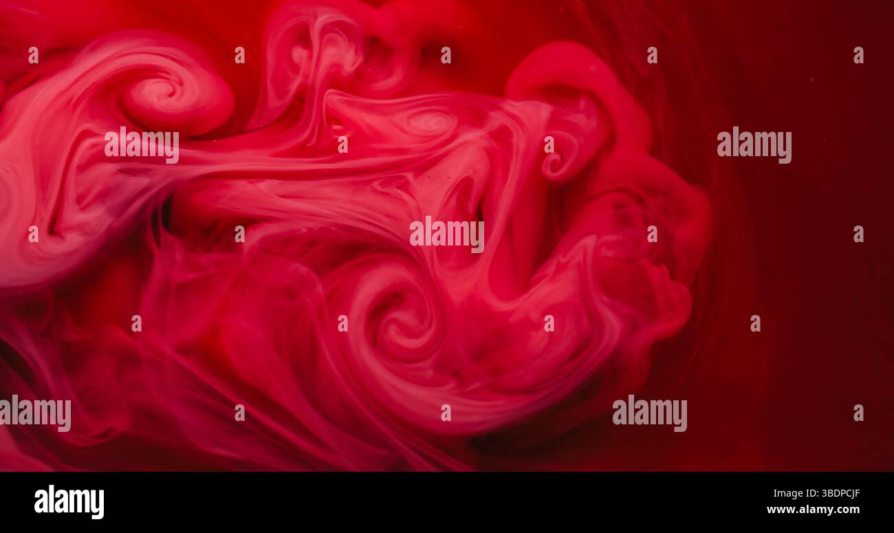 Ink water. Splash paint mix. Defocused red crimson pink color smoke ...