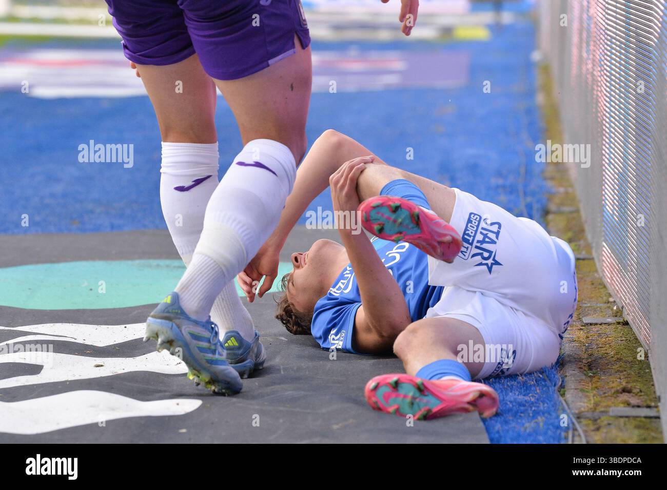 Genk, Belgium. 25th May, 2025. Anderlecht's Jan-Carlo Simic and Genk's Konstantinos Kos Karetsas ...