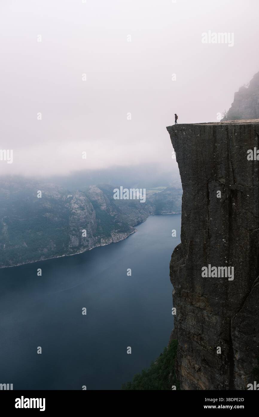 Woman gazing out over cliff hi-res stock photography and images - Alamy