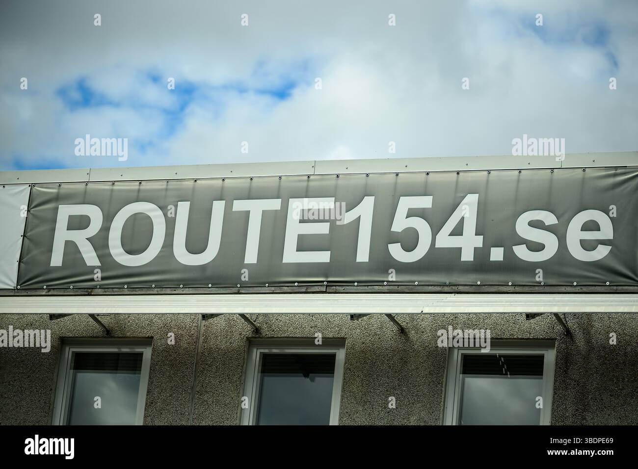 A large sign displays the text Route 154 under a cloudy sky. The sign ...